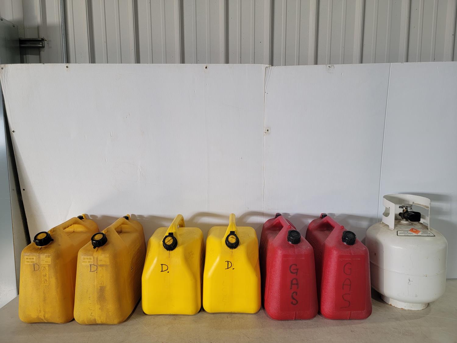 (4) 20L Diesel Jerry Cans, (2) 20L Gas Jerry Cans and (1) 20 lb Propane ...
